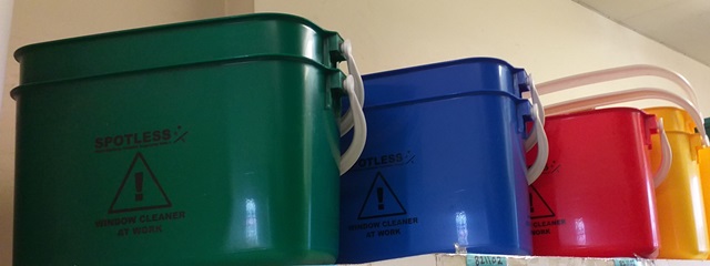 Bucket printed with Caution Window Cleaner working